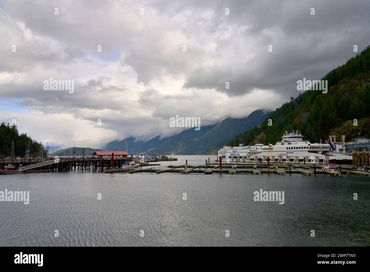 The BC Ferry Horseshoe Bay terminal with two docked ferries and ...