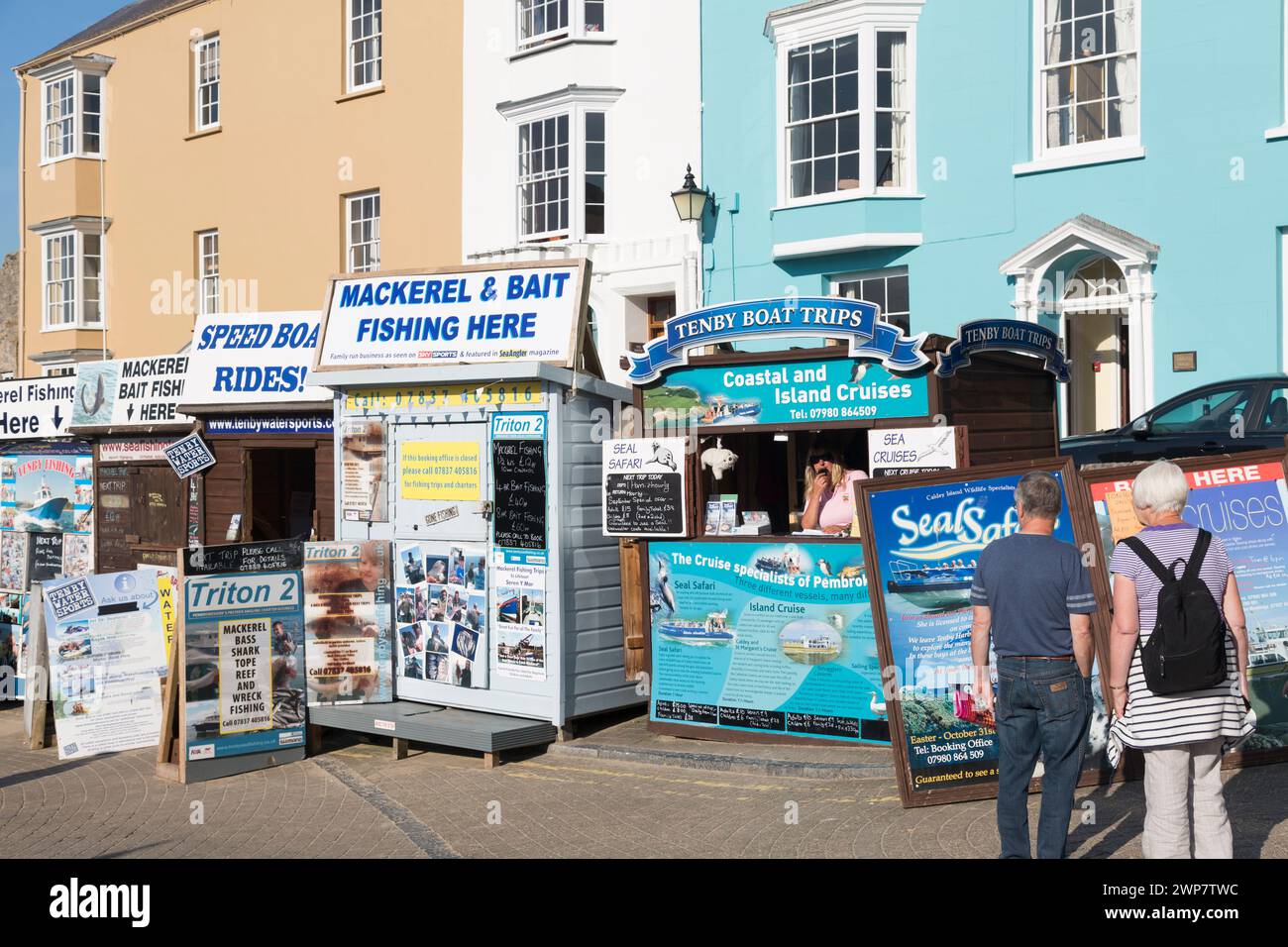 UK, Tenby, Fishing trips bill boards on the harbour Stock Photo - Alamy