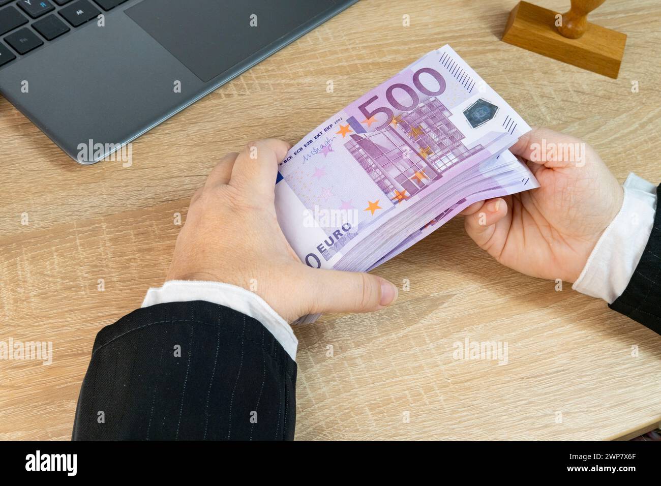 Close-up of female bank employee's hands counting euro bills, paper ...