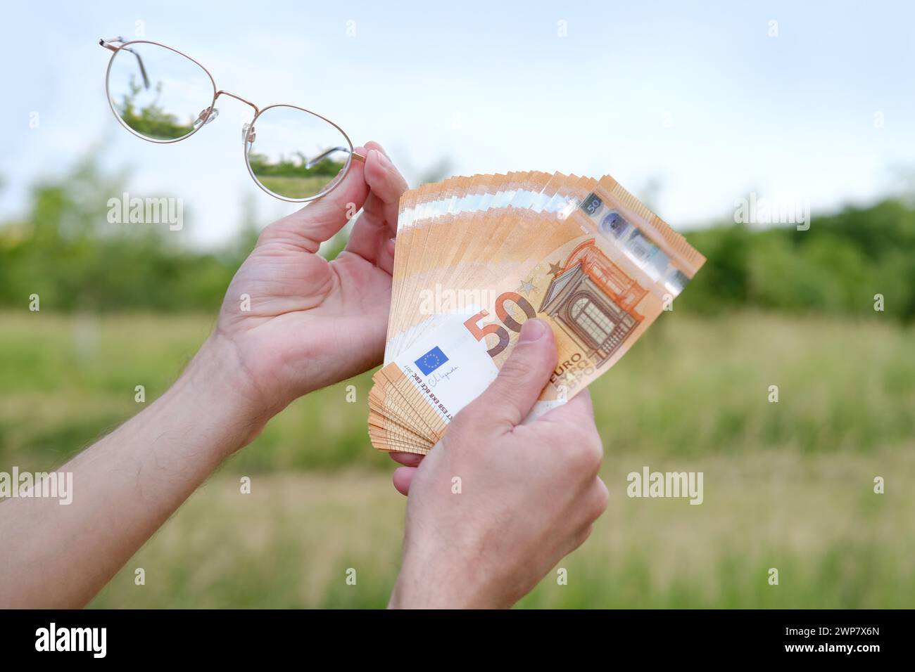 Man looking through financial hi-res stock photography and images - Alamy