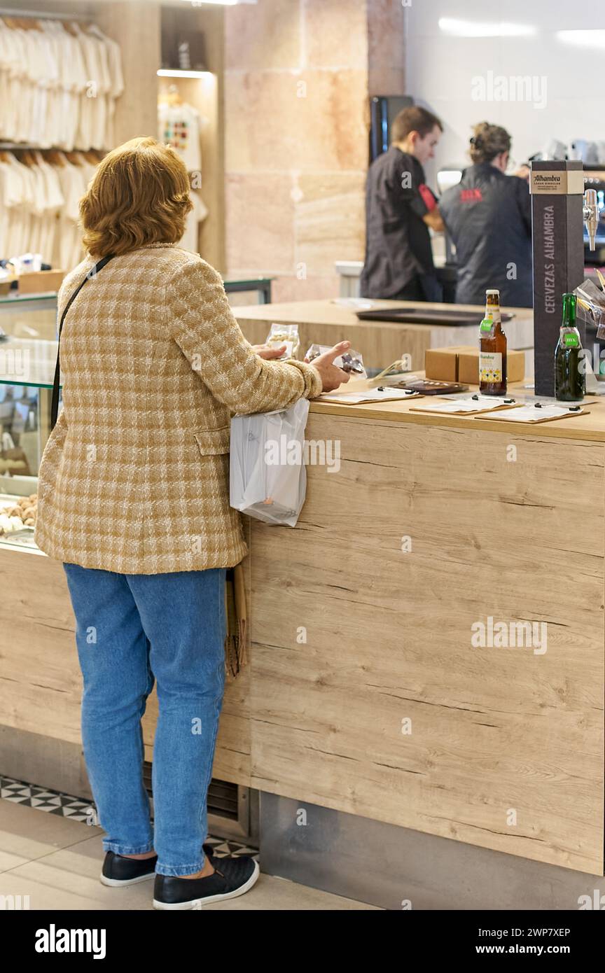 Barcelona, Spain - March 06, 2024: A visitor looks with interest at the ...