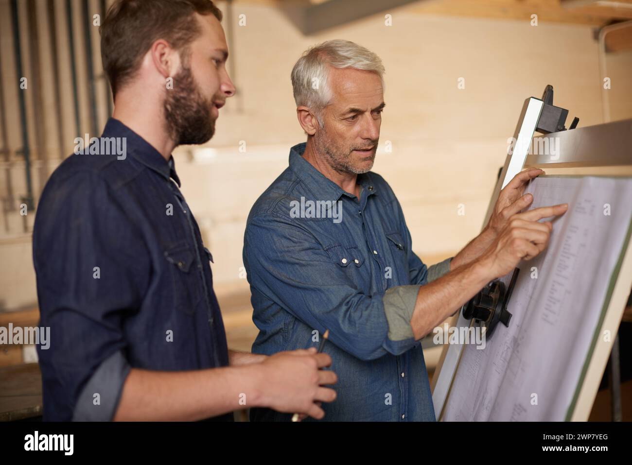 Carpenter, team and men with blueprint for construction, planning ...