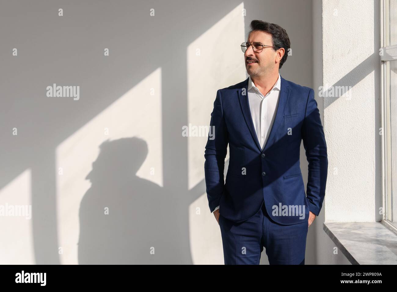 Sharp blue suit hi-res stock photography and images - Alamy