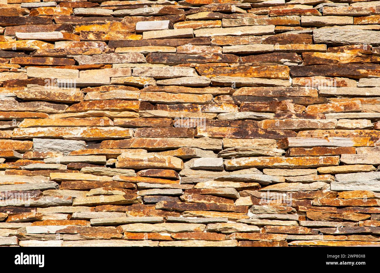 A wall of stacked stone pieces Stock Photo - Alamy