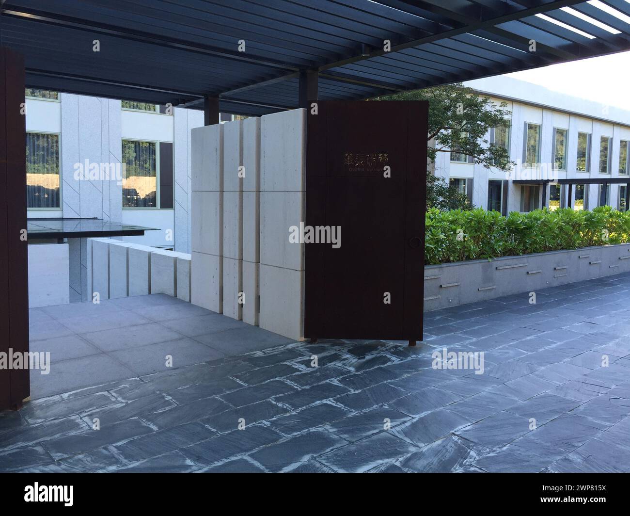 An open door in a courtyard outside a building Stock Photo - Alamy