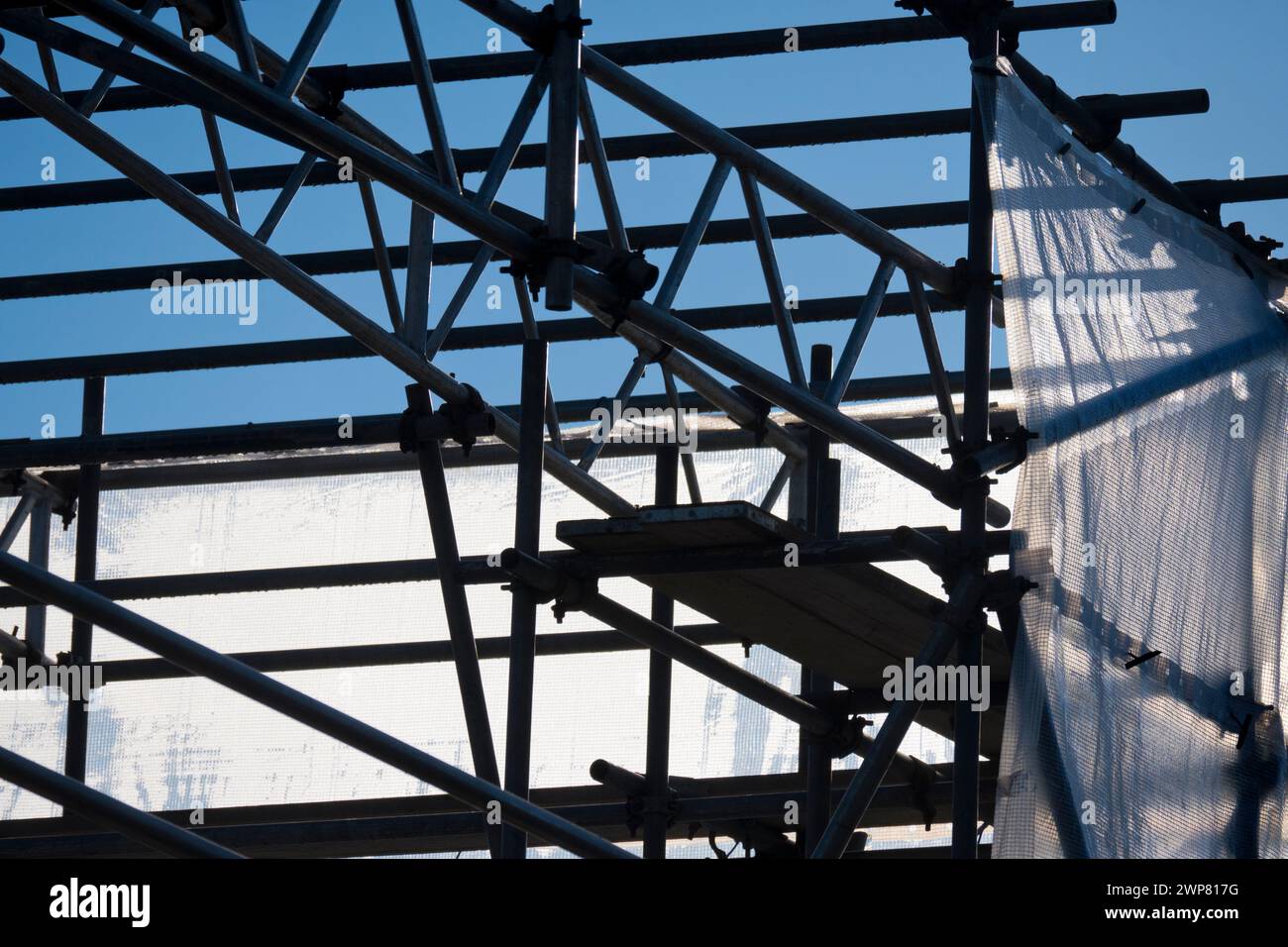 Scaffolding and tarpaulins - at a construction site for a new factory ...