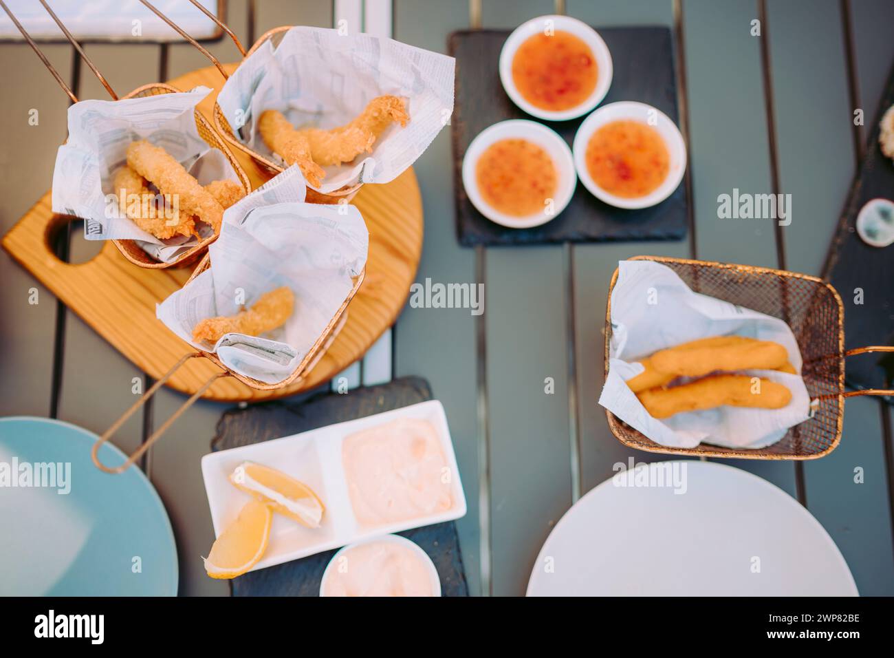 Delicious fried shrimps elegantly served with sauces on the restaurant ...