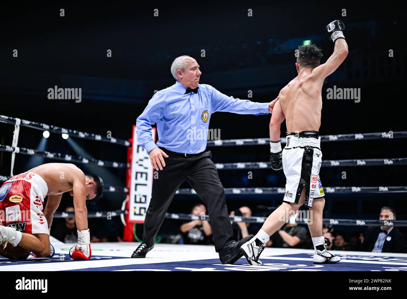 Tokyo, Japan. 24th Feb, 2024. Japan's Takuma Inoue, right, is led to a ...