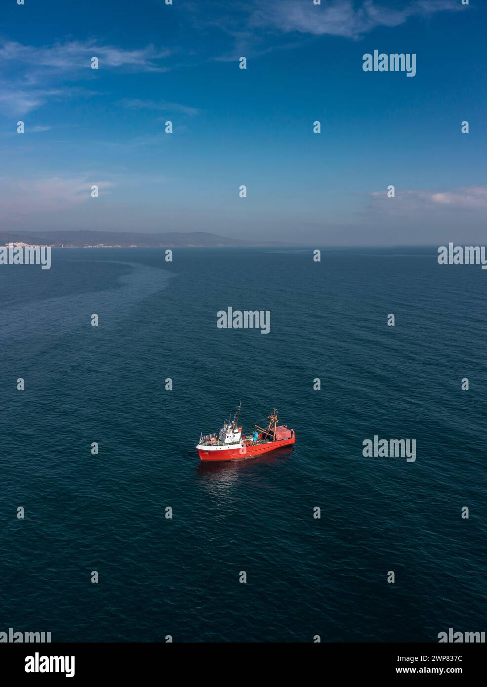 Aerial view to a red fishing vessel in sea Stock Photo - Alamy