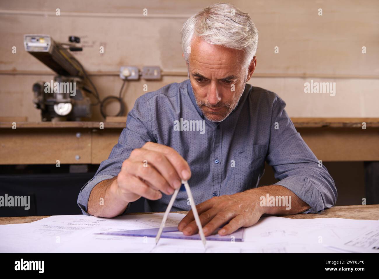 Mature man, compass and architect drawing blueprint, construction and ...