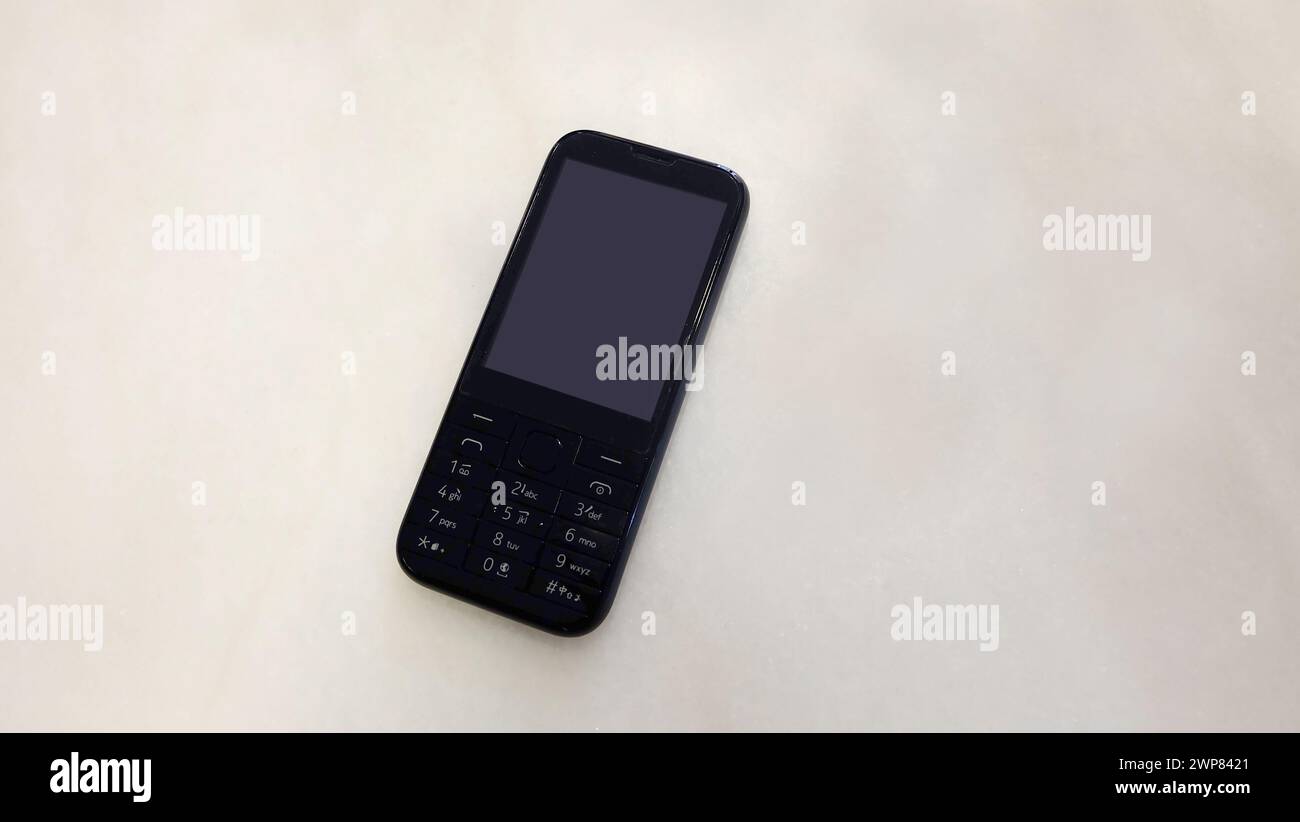 A black obsolete cellphone with blank screen Stock Photo - Alamy
