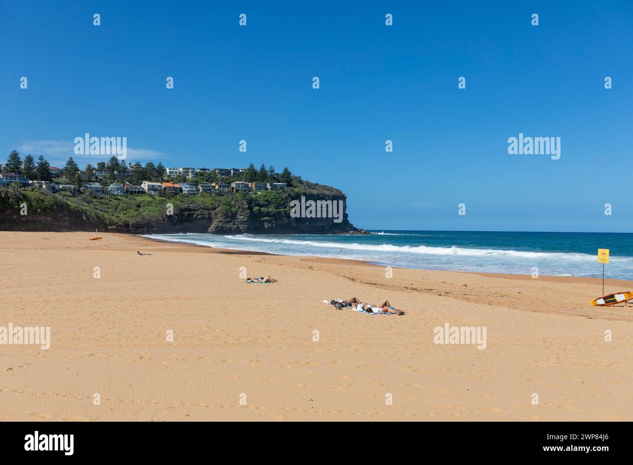 Couple sunbathing on Bilgola Beach on Sydney northern beaches,NSW ...