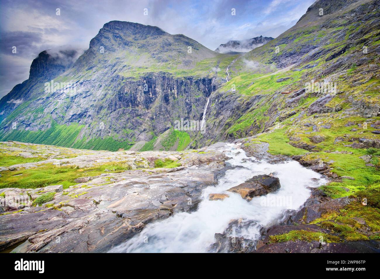 Waterfall and mountains near the viewpoint over Trollstigen road ...