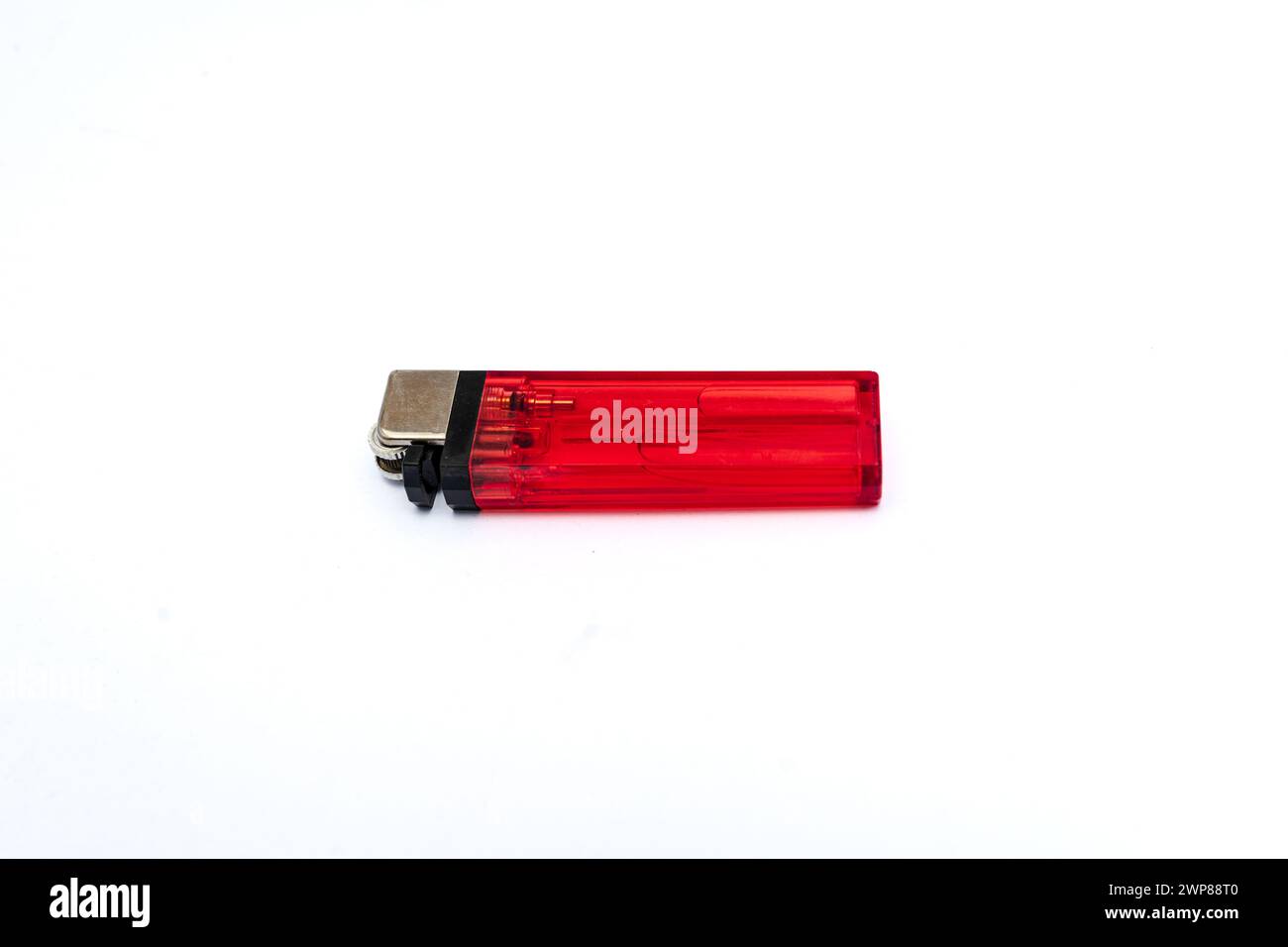 Cheap red cigarette gas lighter made of plastic isolated on white ...