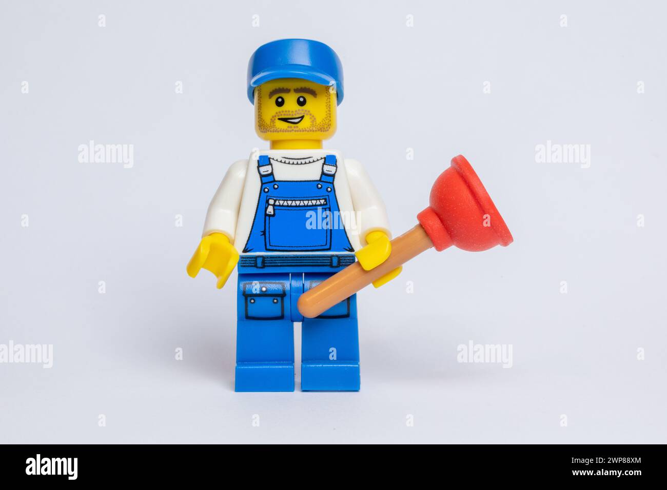 A male plumber as shown in Lego against a plain background Stock Photo ...