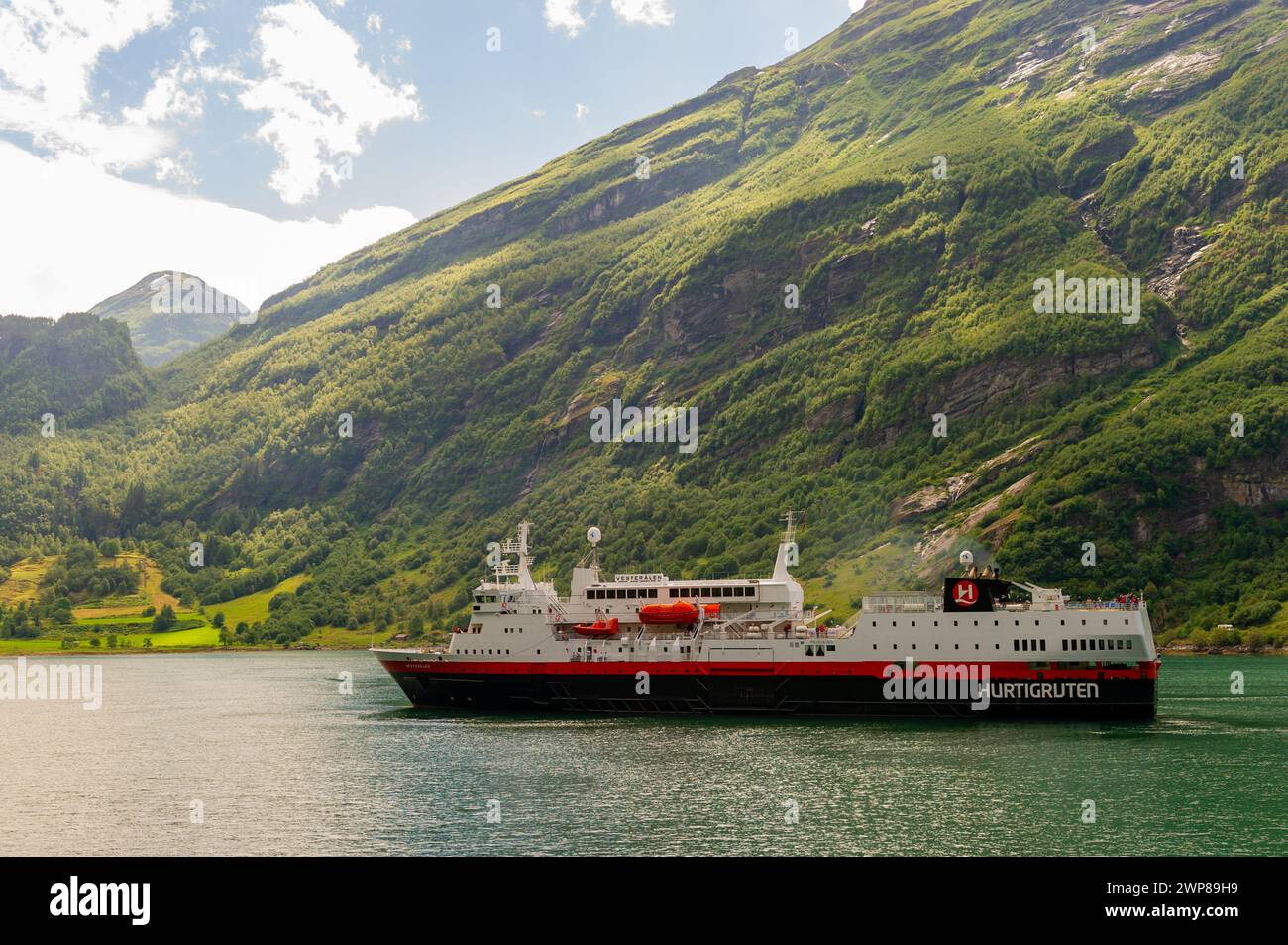 The MS Vesterålen a Hurtigruten boat passing through the Geiranger ...