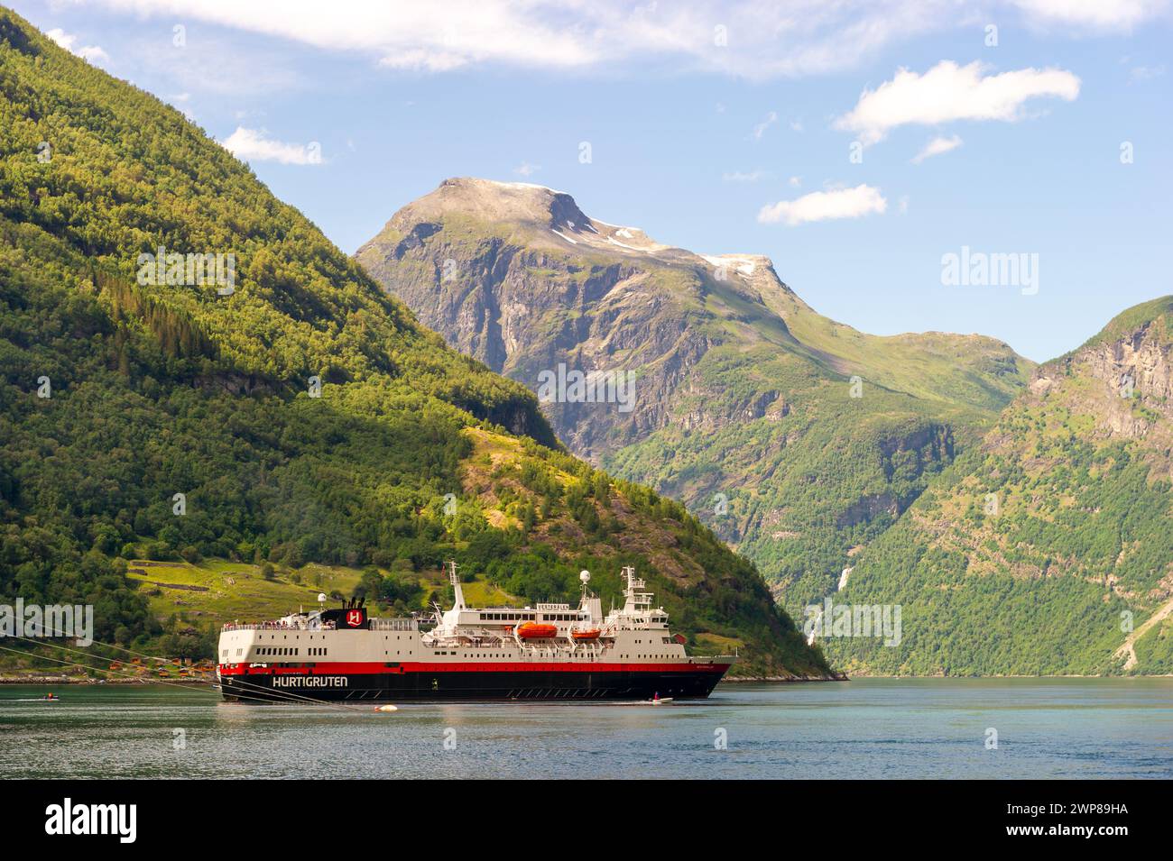 The MS Vesterålen a Hurtigruten boat passing through the Geiranger ...