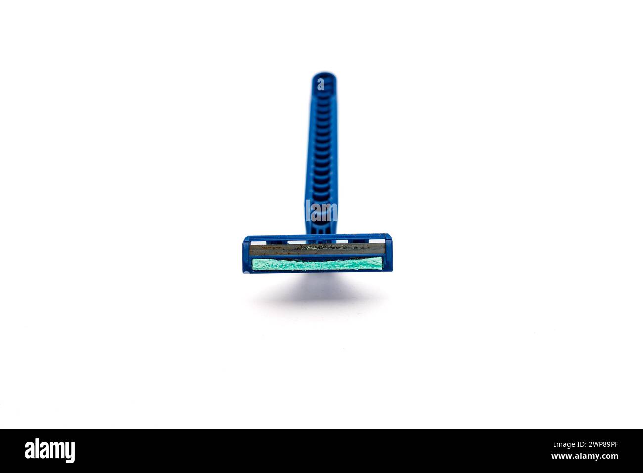 Closeup of used blue disposable razor that is dirty and rusty isolated ...