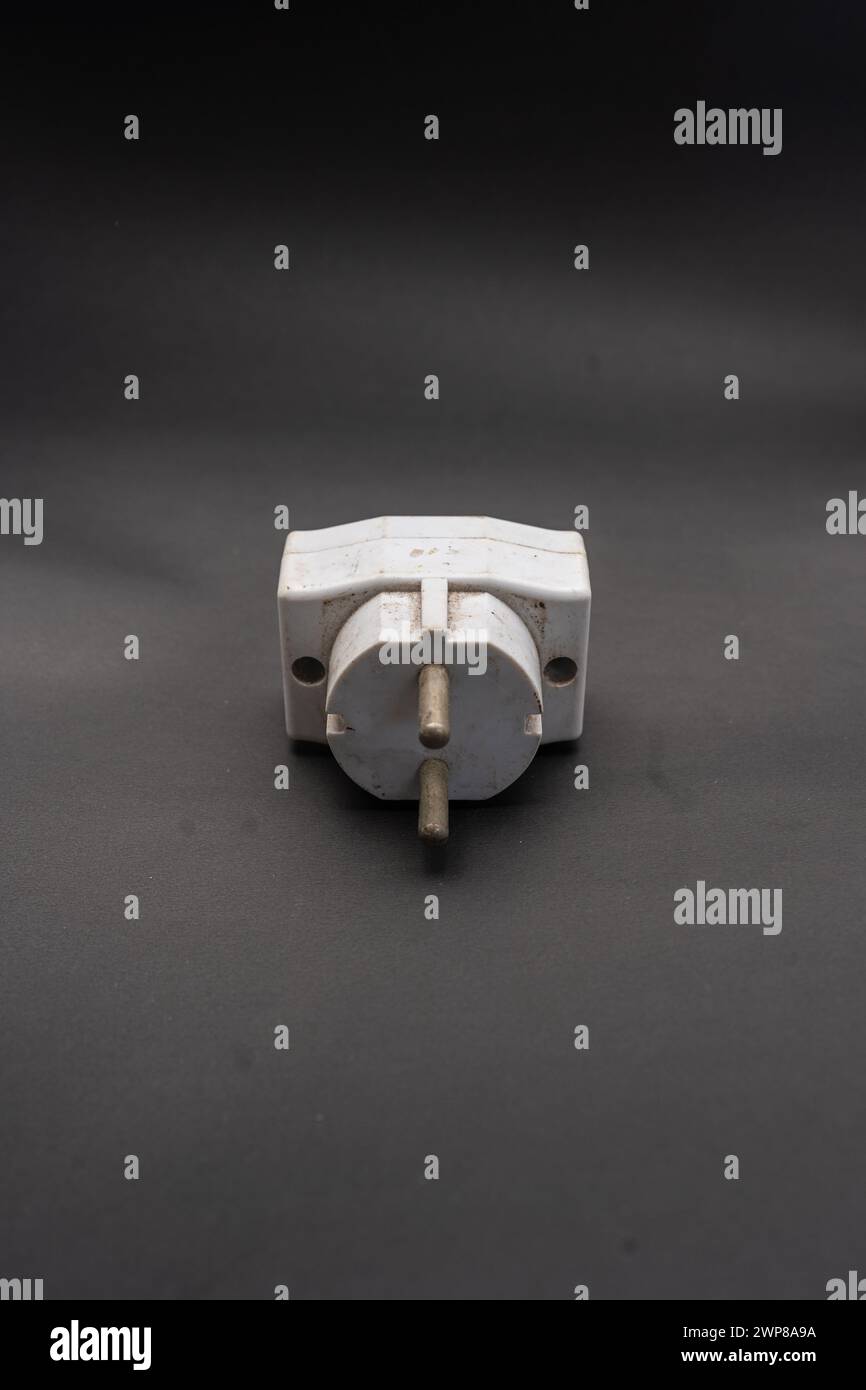 Dirty used triple outlet tap. Electric energy adapter used to split ...