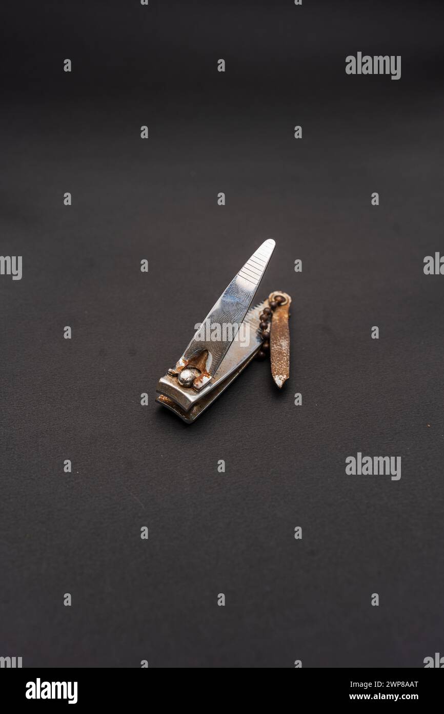 Dirty and rusty used nail clippers made of stainless steel isolater on ...