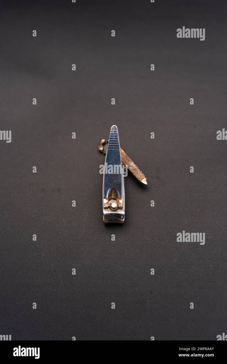 Dirty and rusty used nail clippers made of stainless steel isolater on ...
