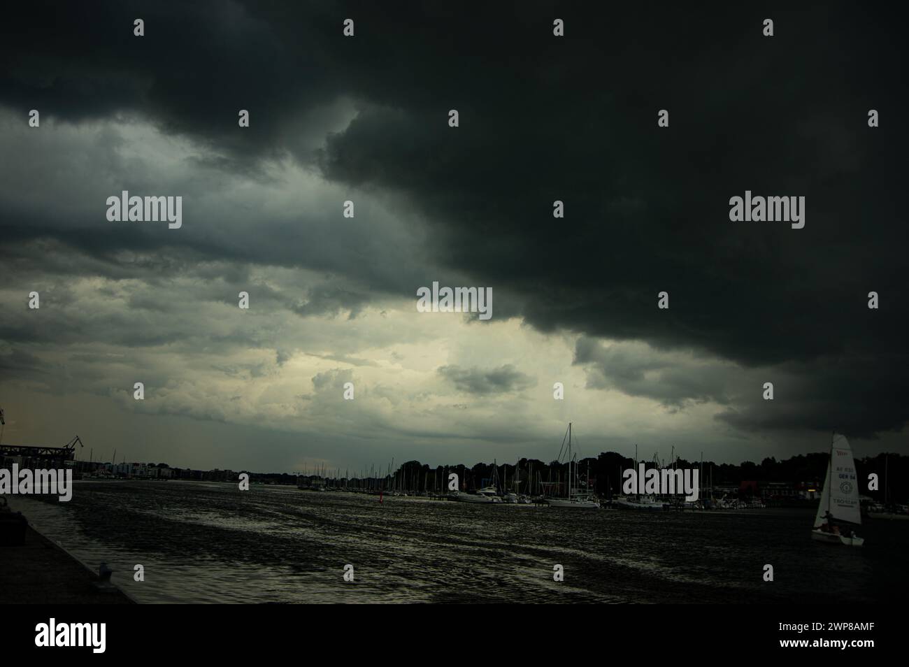 Good and Bad weather in Rostock Germany at the harbour. Boat captured ...