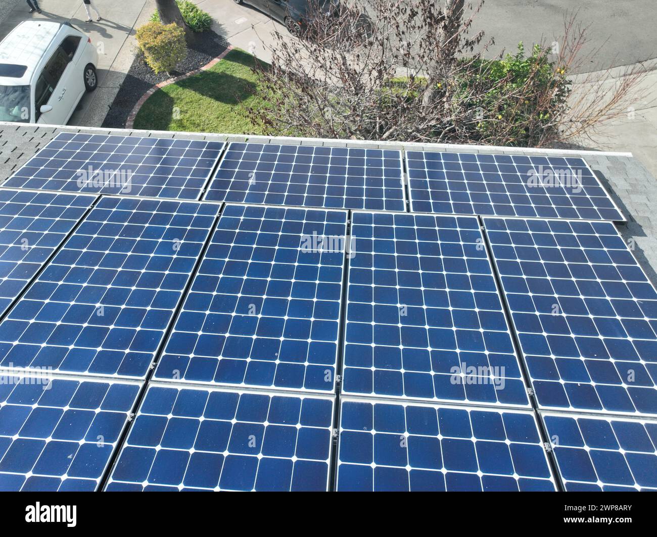 An aerial view of solar panels on an urban rooftop Stock Photo - Alamy
