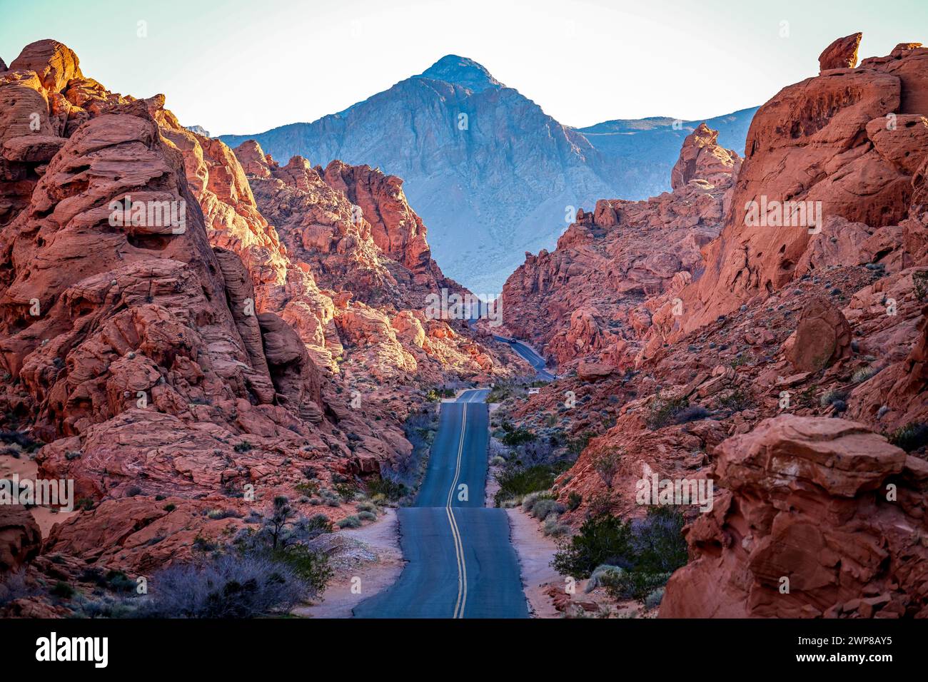 A scenic road meandering through the majesty of the orange landscape of ...