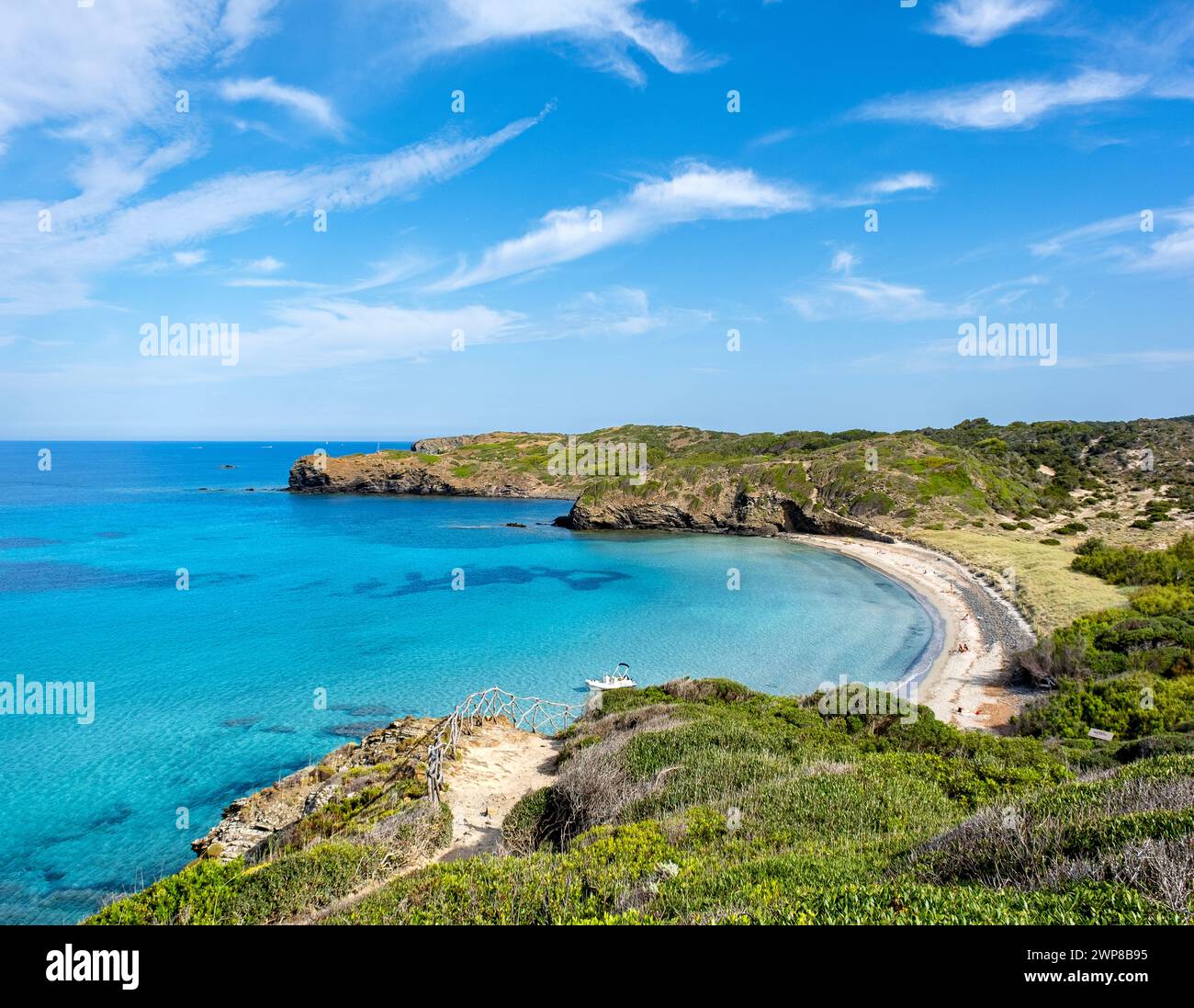 Spanish paradise beach with a boat Stock Photo - Alamy