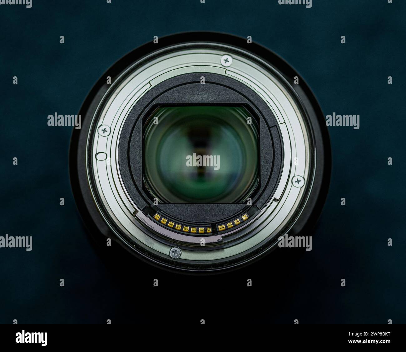 A Canon RF 24-70 F2.8 IS USM mirrorless full frame lens on a dark ...