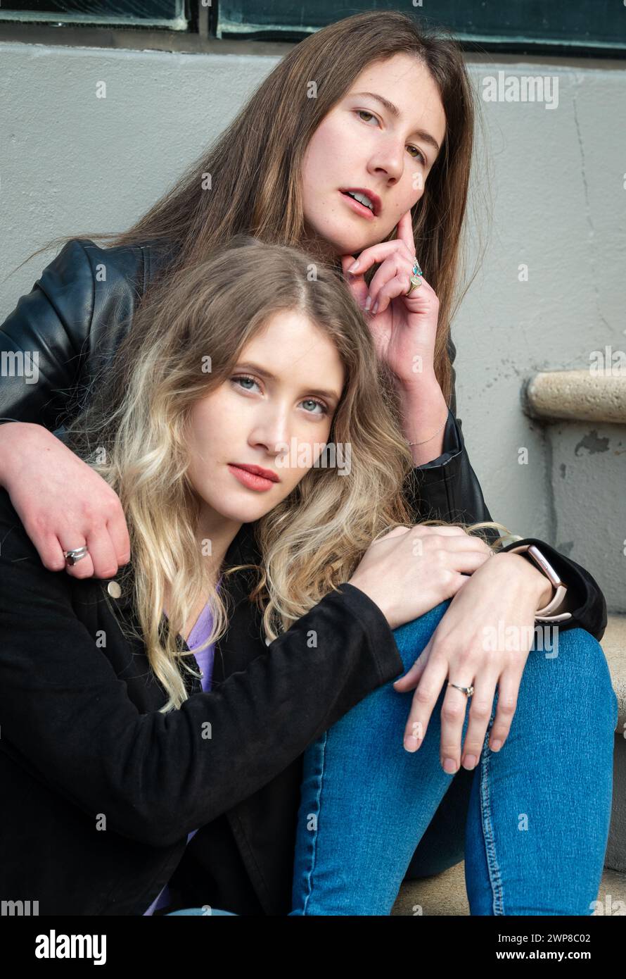 Two Girls One Brunette And One Blonde Sitting On City Stairs Stock 2861