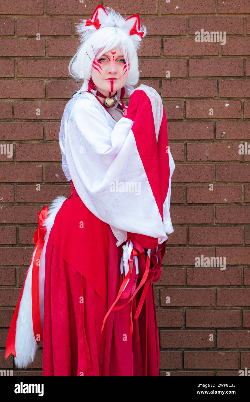Female cosplayer in feline priestess attire at a convention Stock Photo ...