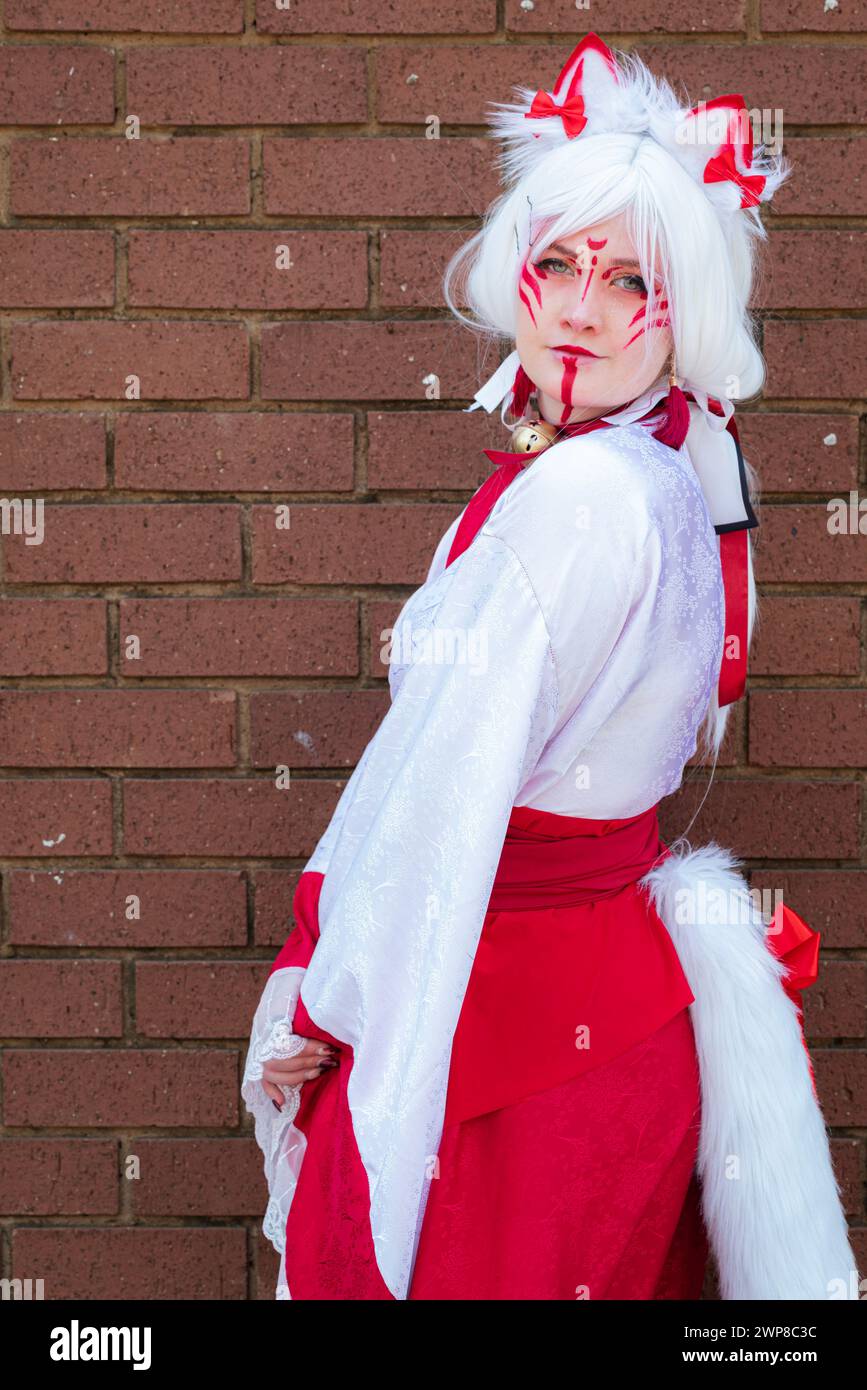 Female cosplayer in feline priestess attire at a convention Stock Photo ...