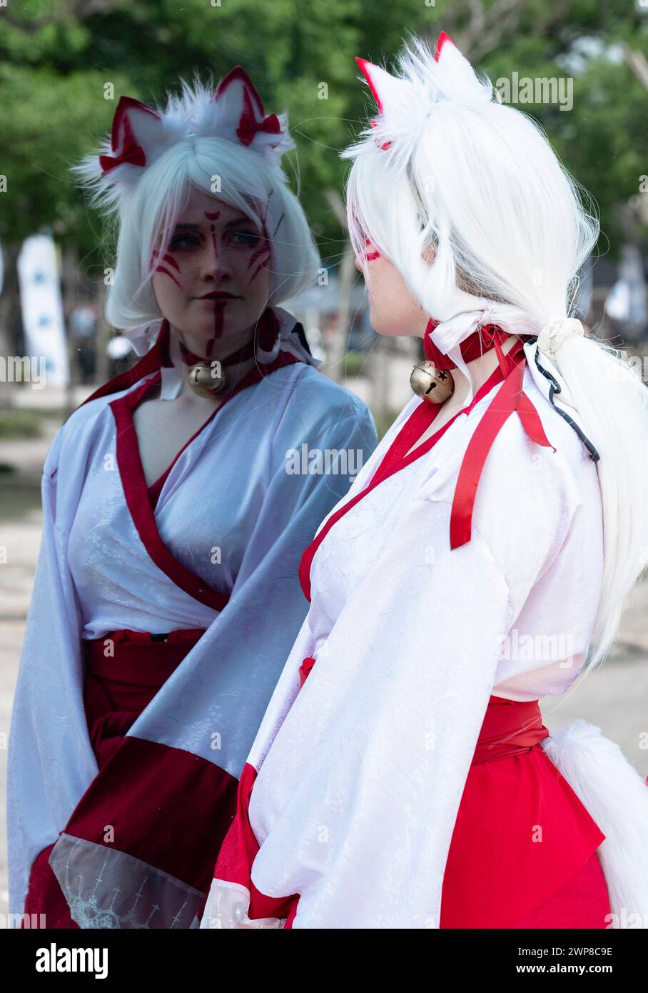 Female cosplayer in feline priestess attire at a convention Stock Photo ...