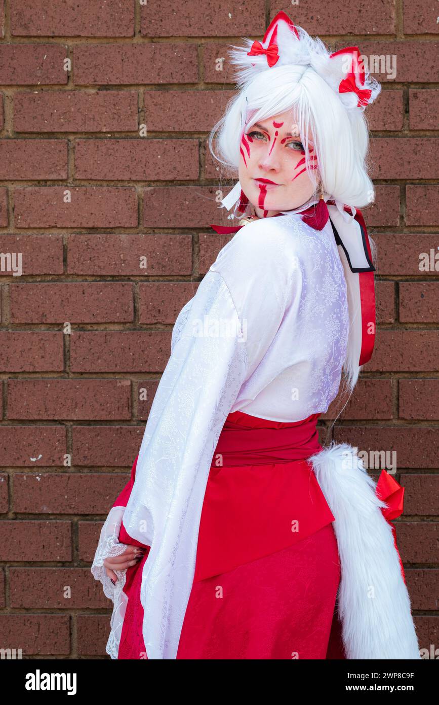 Female cosplayer in feline priestess attire at a convention Stock Photo ...