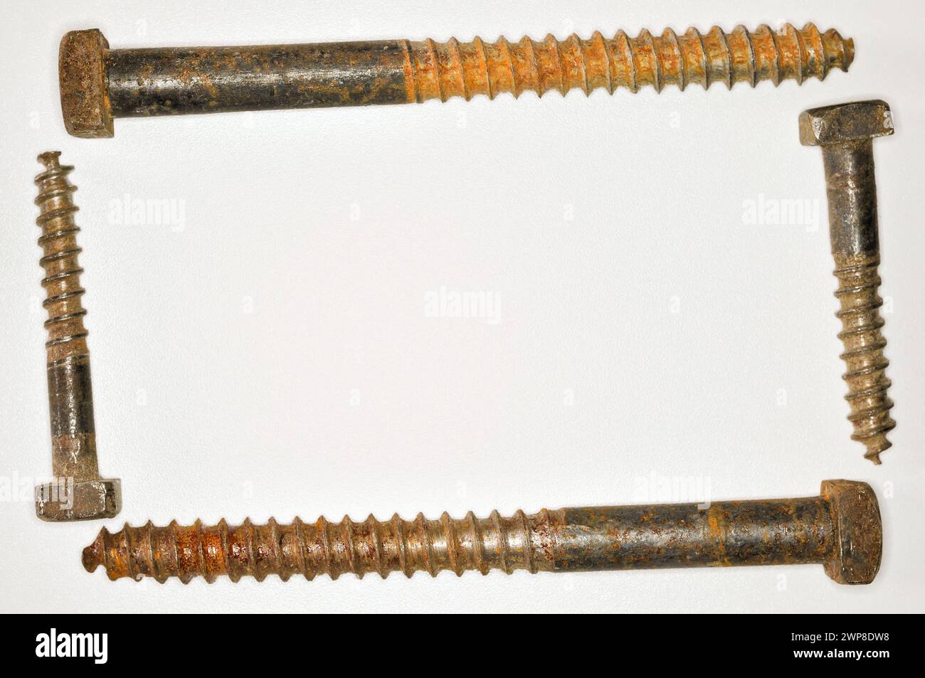 Big Rusty screws arranged as a framework Stock Photo - Alamy