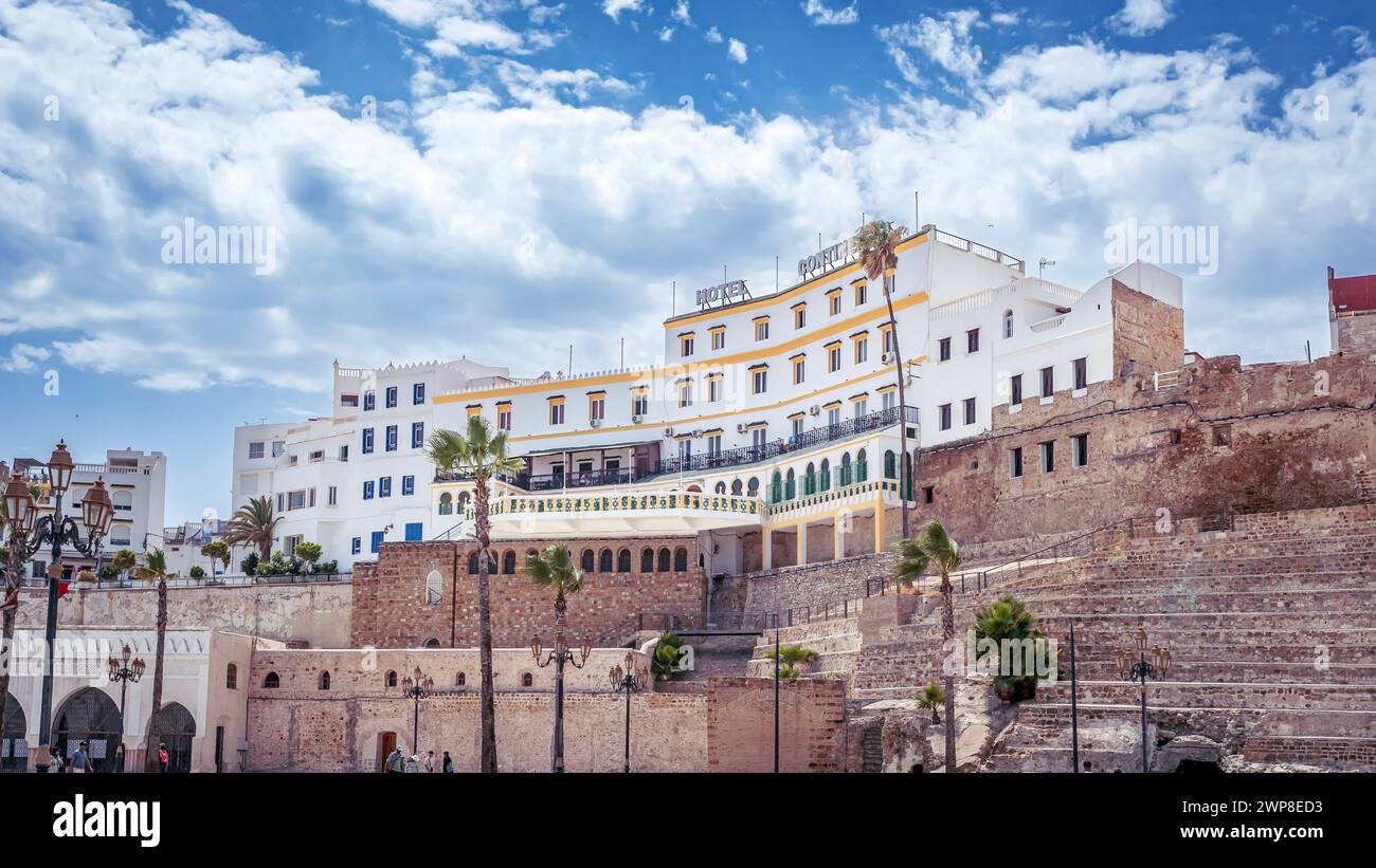 A charming castle-like structure amid towering buildings during daytime ...