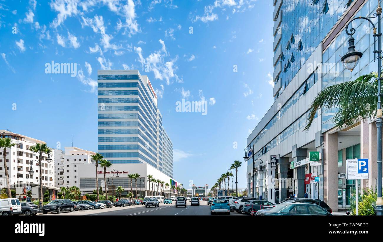 A busy street in Tanger, Morocco with modern architecture and cars ...