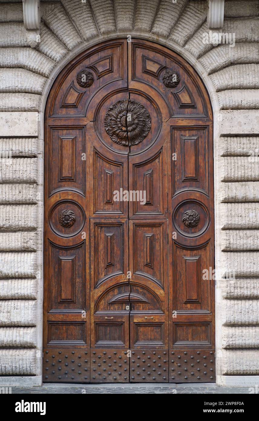 doors of Rome. Classic old wooden door in a public place on a city ...