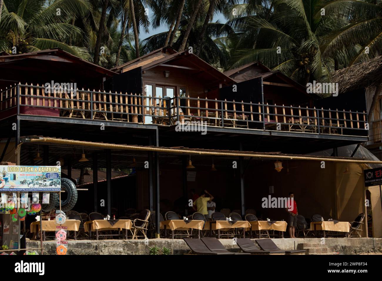 The buildings on a sandy beach of Goa in India Stock Photo - Alamy