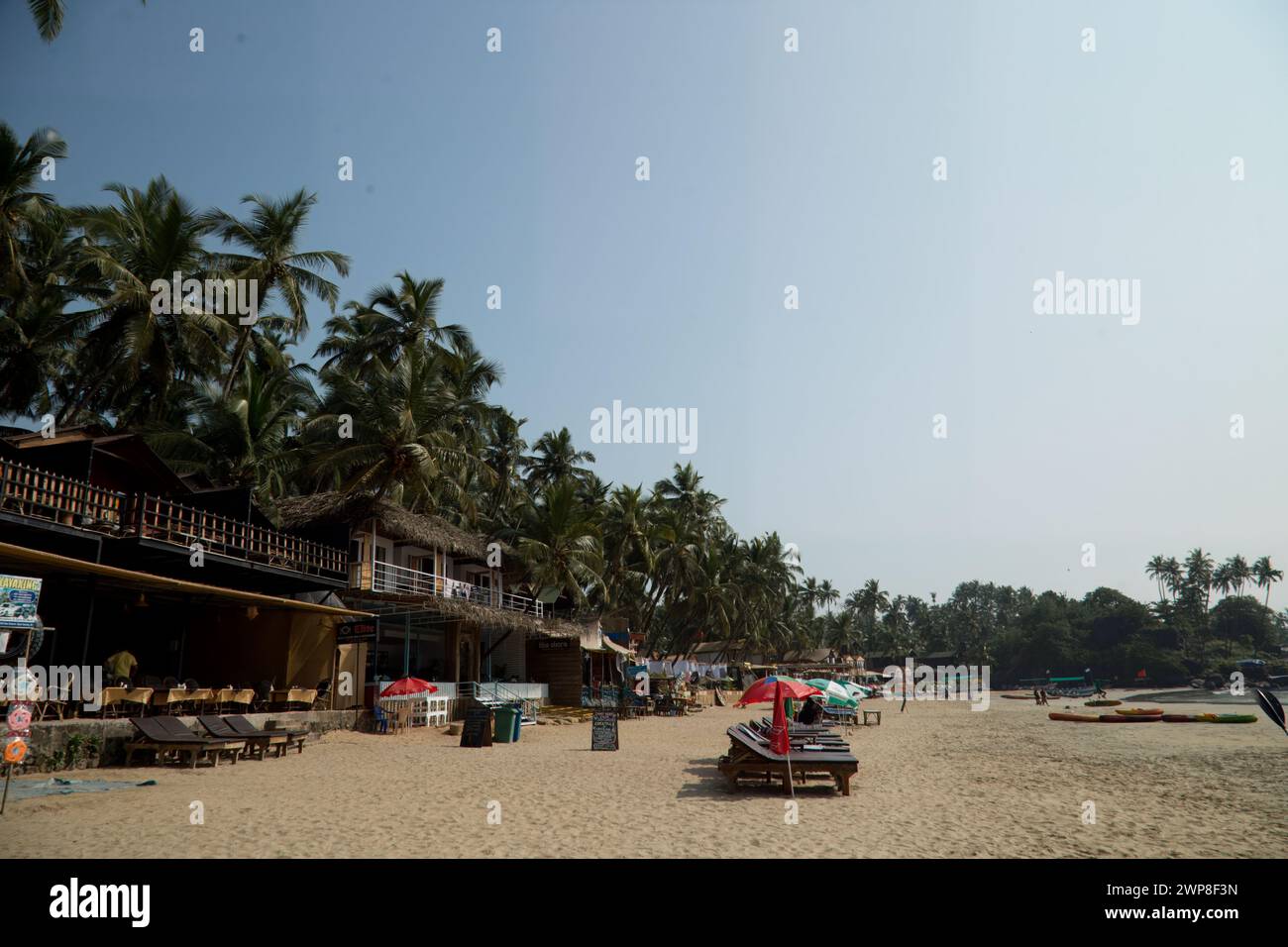 The buildings on a sandy beach of Goa in India Stock Photo - Alamy