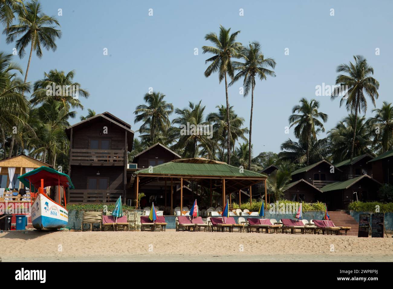 The buildings on a sandy beach of Goa in India Stock Photo - Alamy