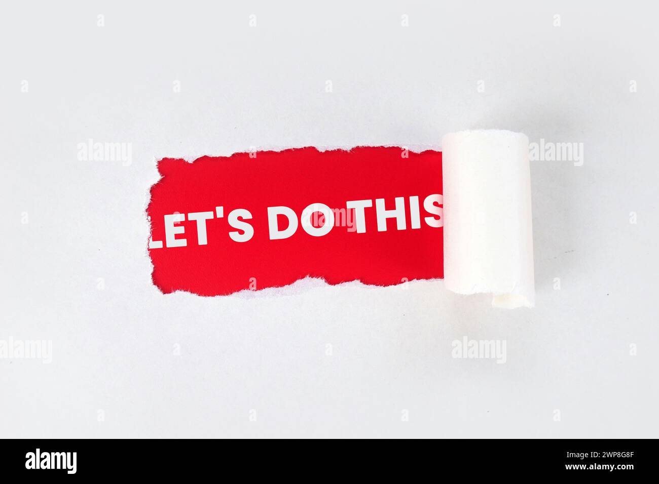 Torn paper with a hole showing the words Let's do this Stock Photo - Alamy