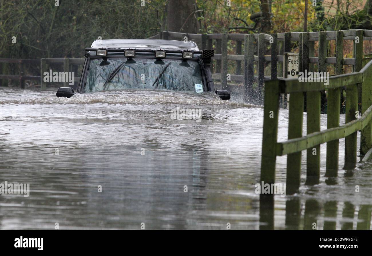 21/11/12 A Land Rover pushes through flood water near Solihull - the ...