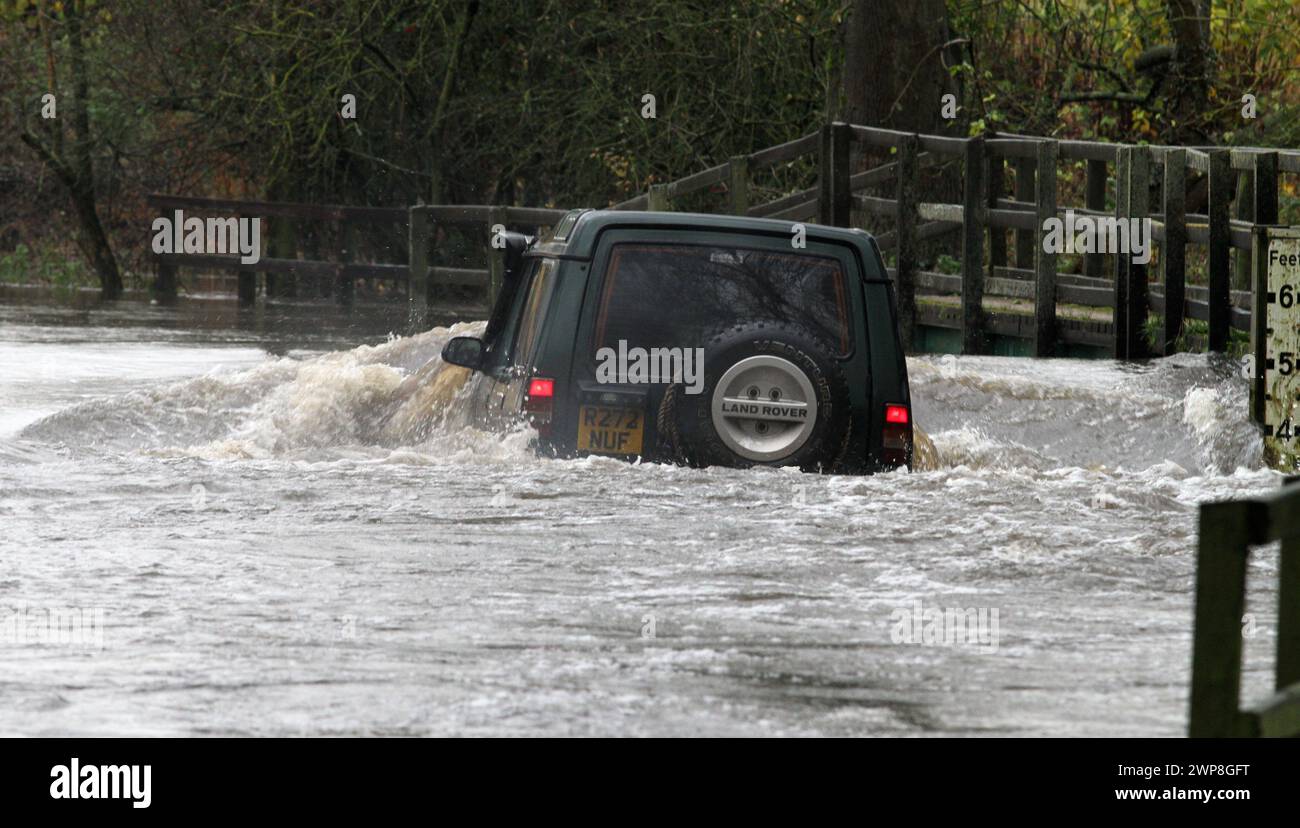 21/11/12 A Land Rover pushes through flood water near Solihull - the ...
