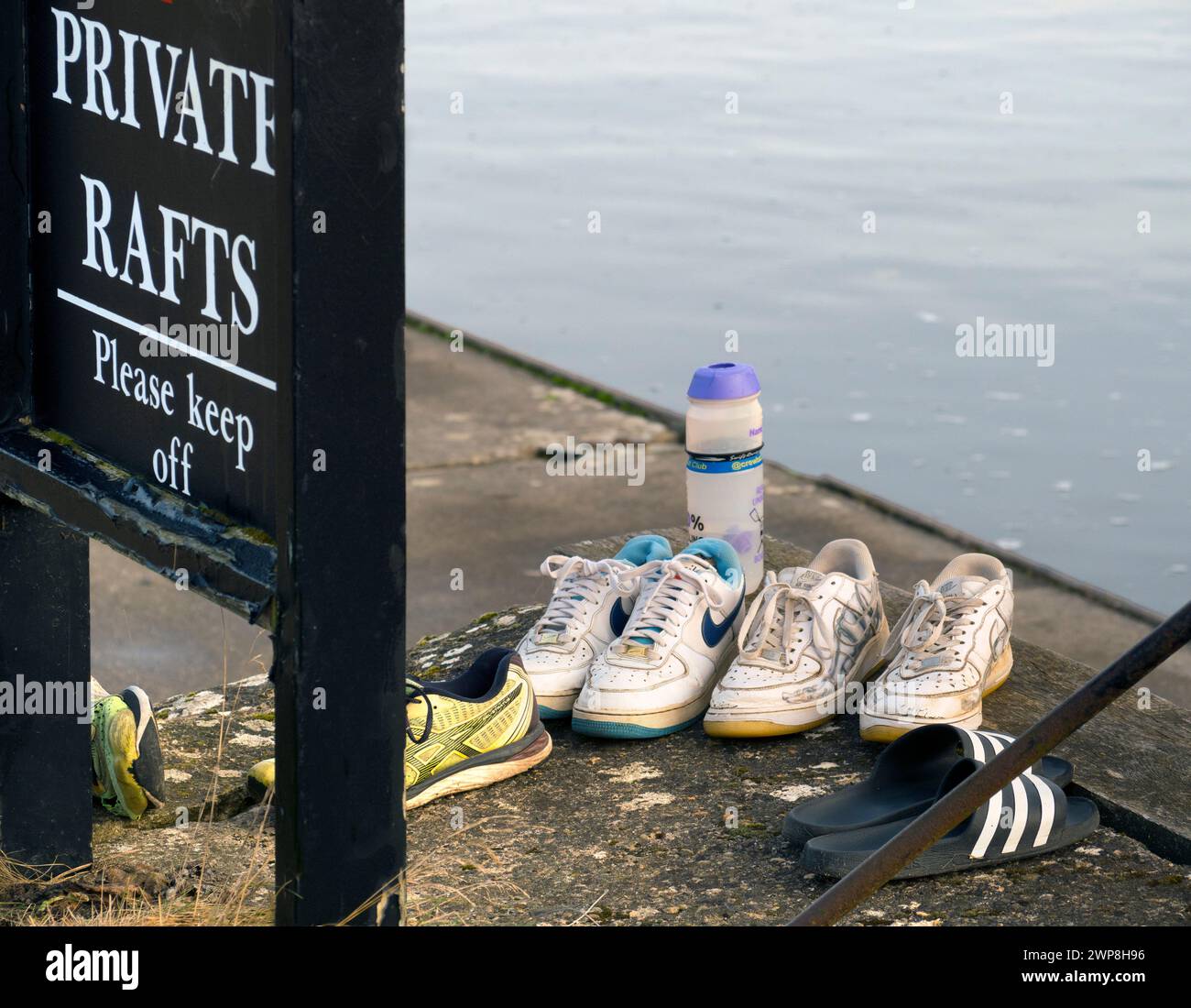 Still life with shoes and sign outside Radley boathouse by the Thames ...