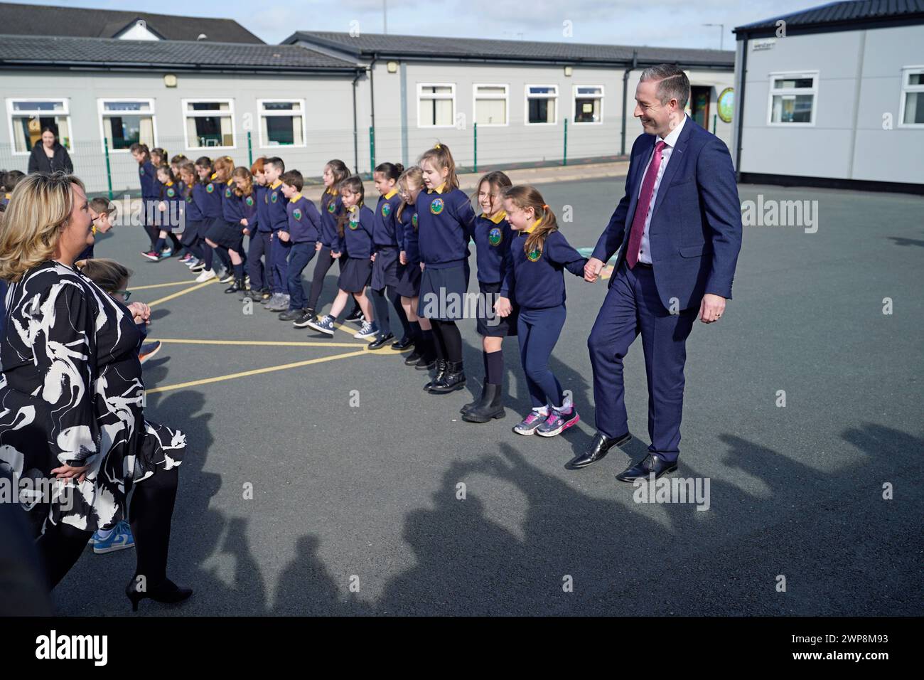 Northern Ireland Education Minister Paul Givan takes part in a ceili dance during a visit to ...