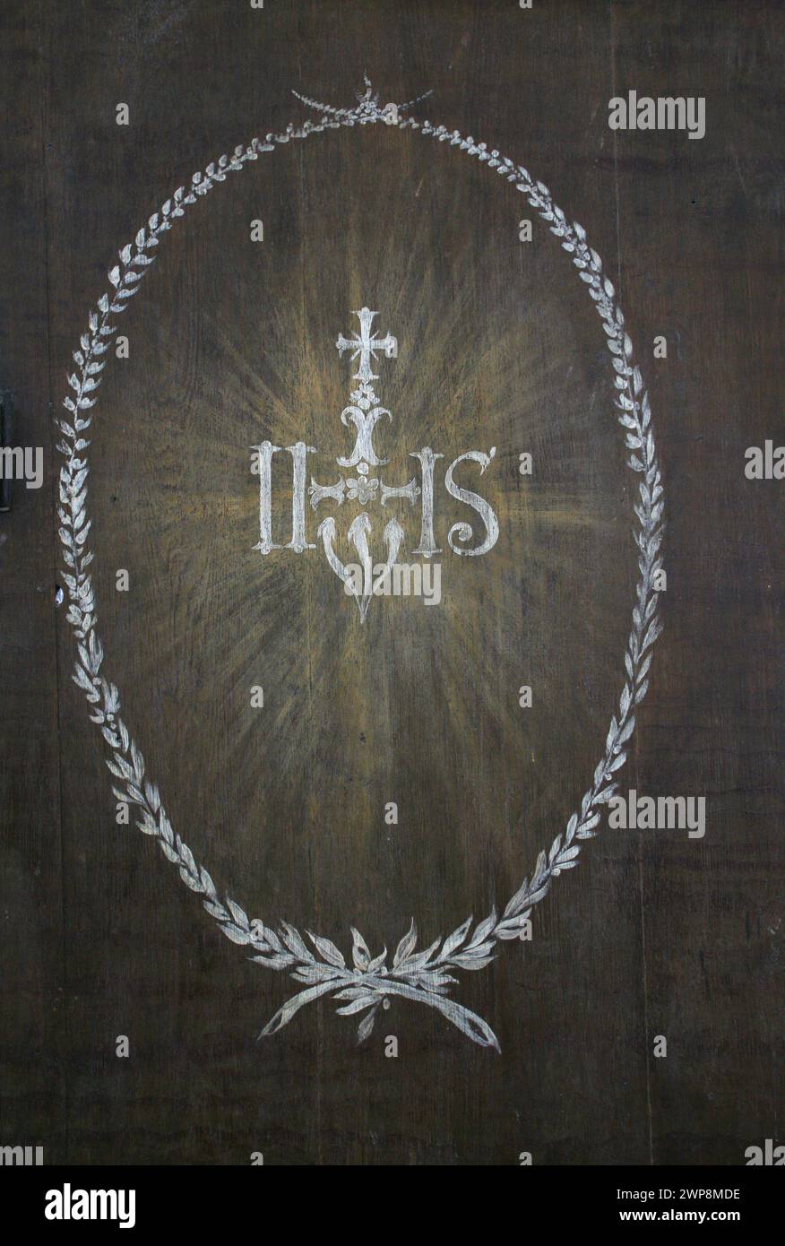 Christ's monogram IHS on the altar in parish Church of Our Lady of snow ...