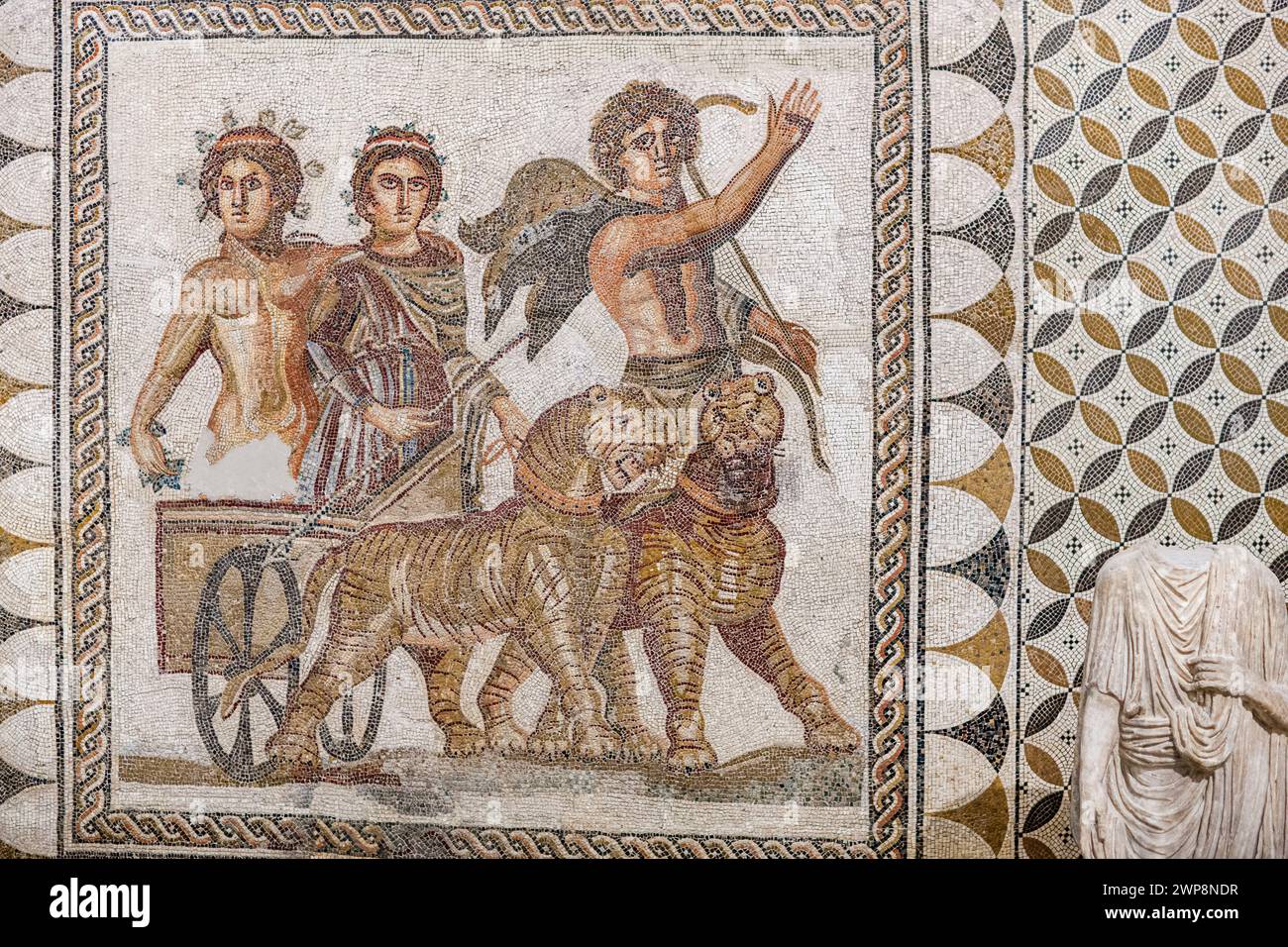 A Roman mosaic depicting Bacchus, ancient god of wine, in a triumphant ...