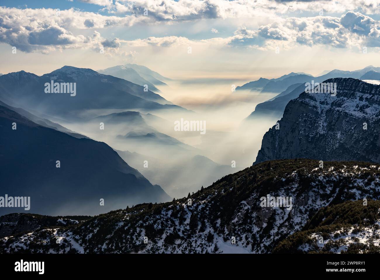 Snow covered Italian Dolomites at winter. Lake garda view in Trentino ...